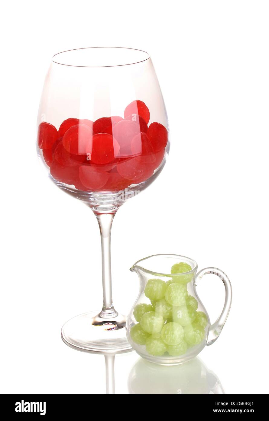 Color candies in glasses isolated on white Stock Photo - Alamy