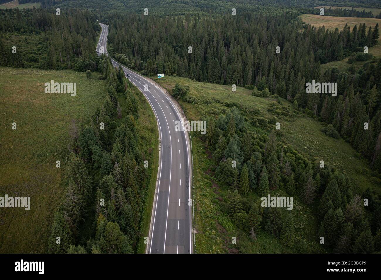 Aerial view on mountain road from drone Stock Photo - Alamy