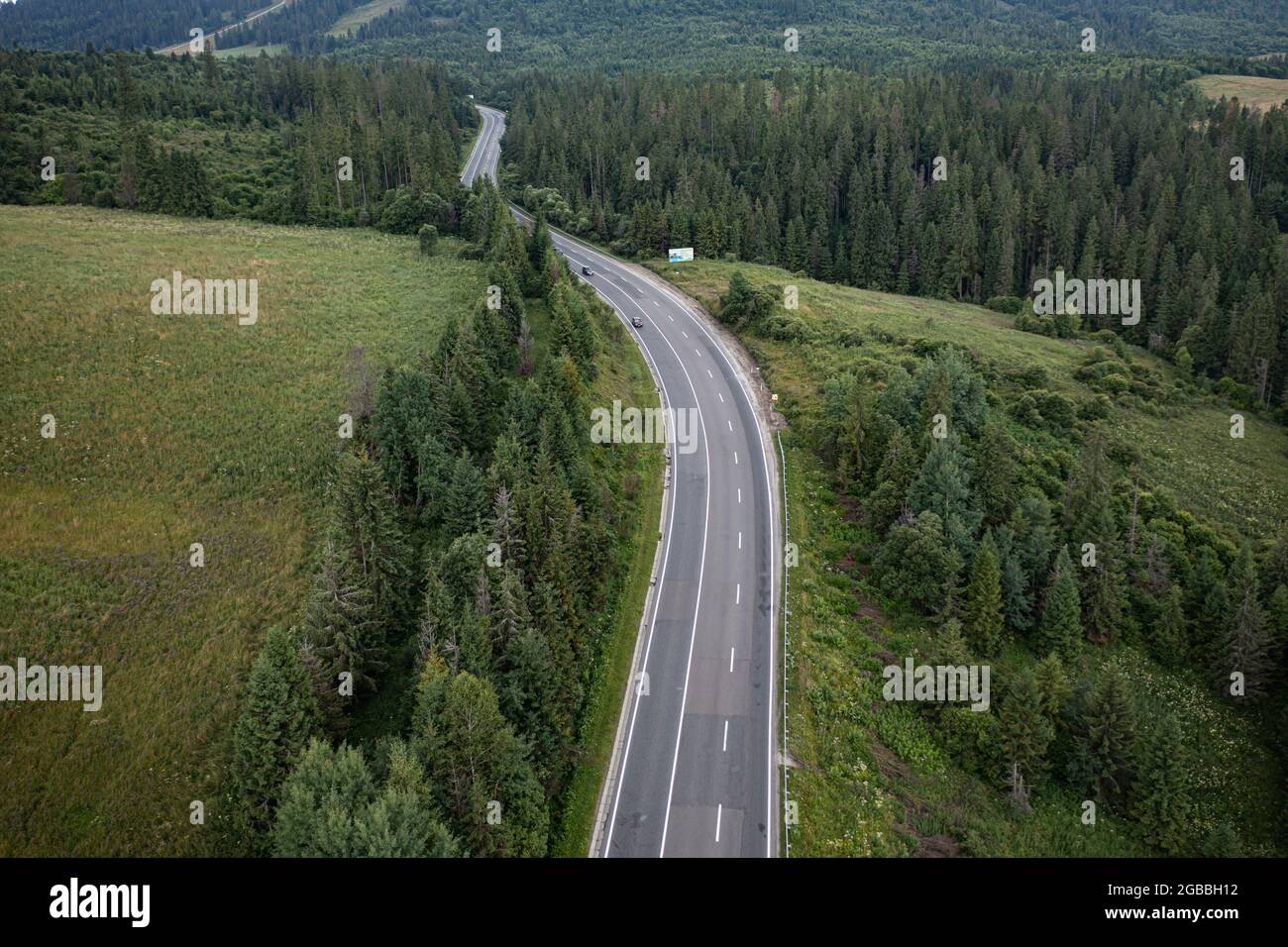 Aerial view on mountain road from drone Stock Photo - Alamy