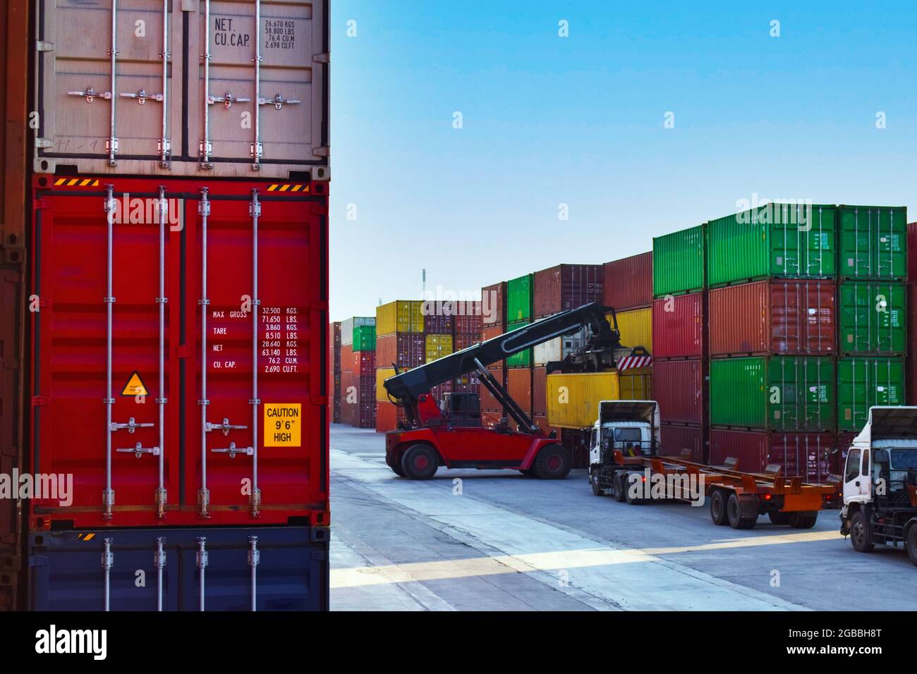 Container yard operation activity, reach stacker load container onto ...