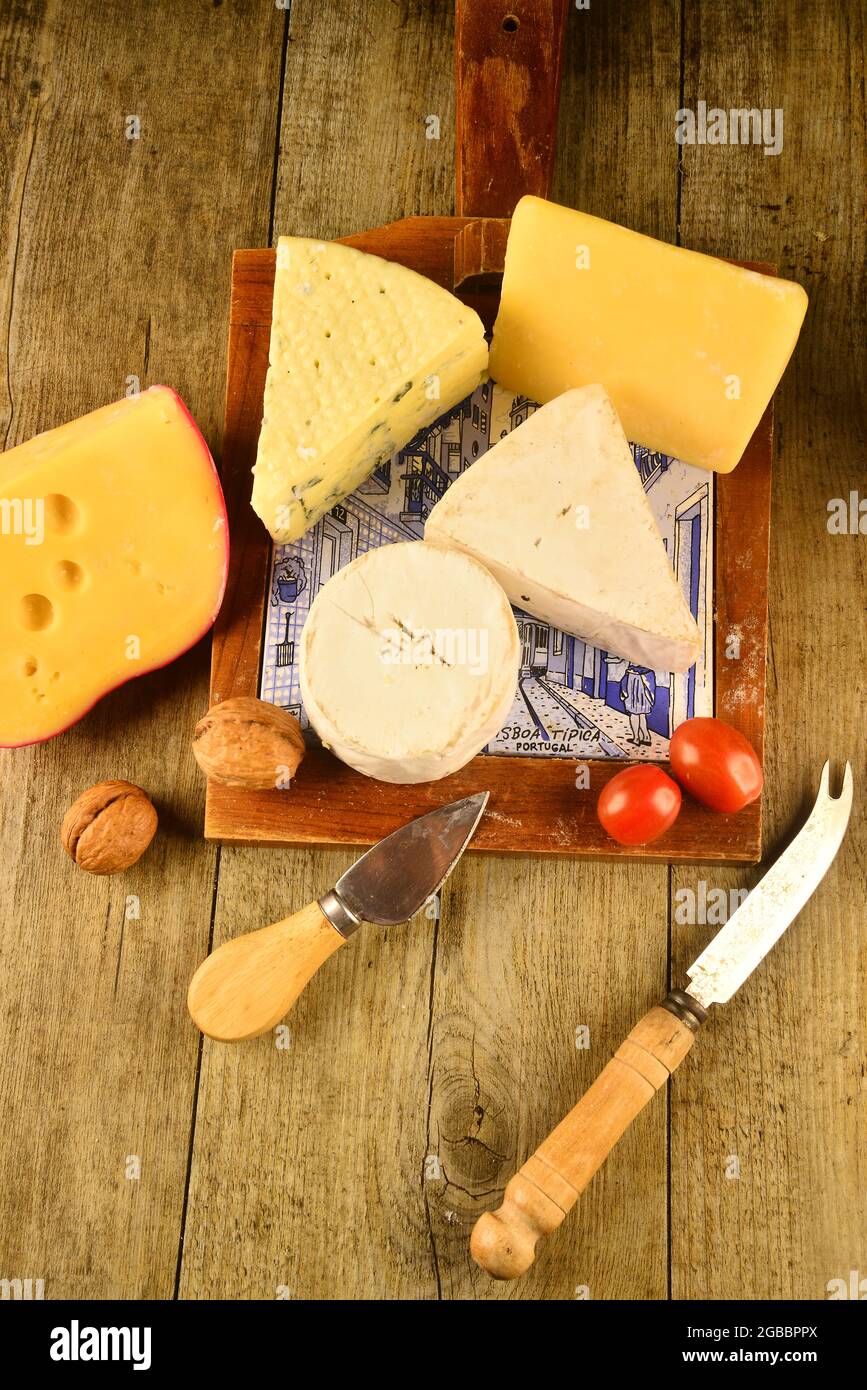 Table of mixed cheese on studio shot Stock Photo - Alamy