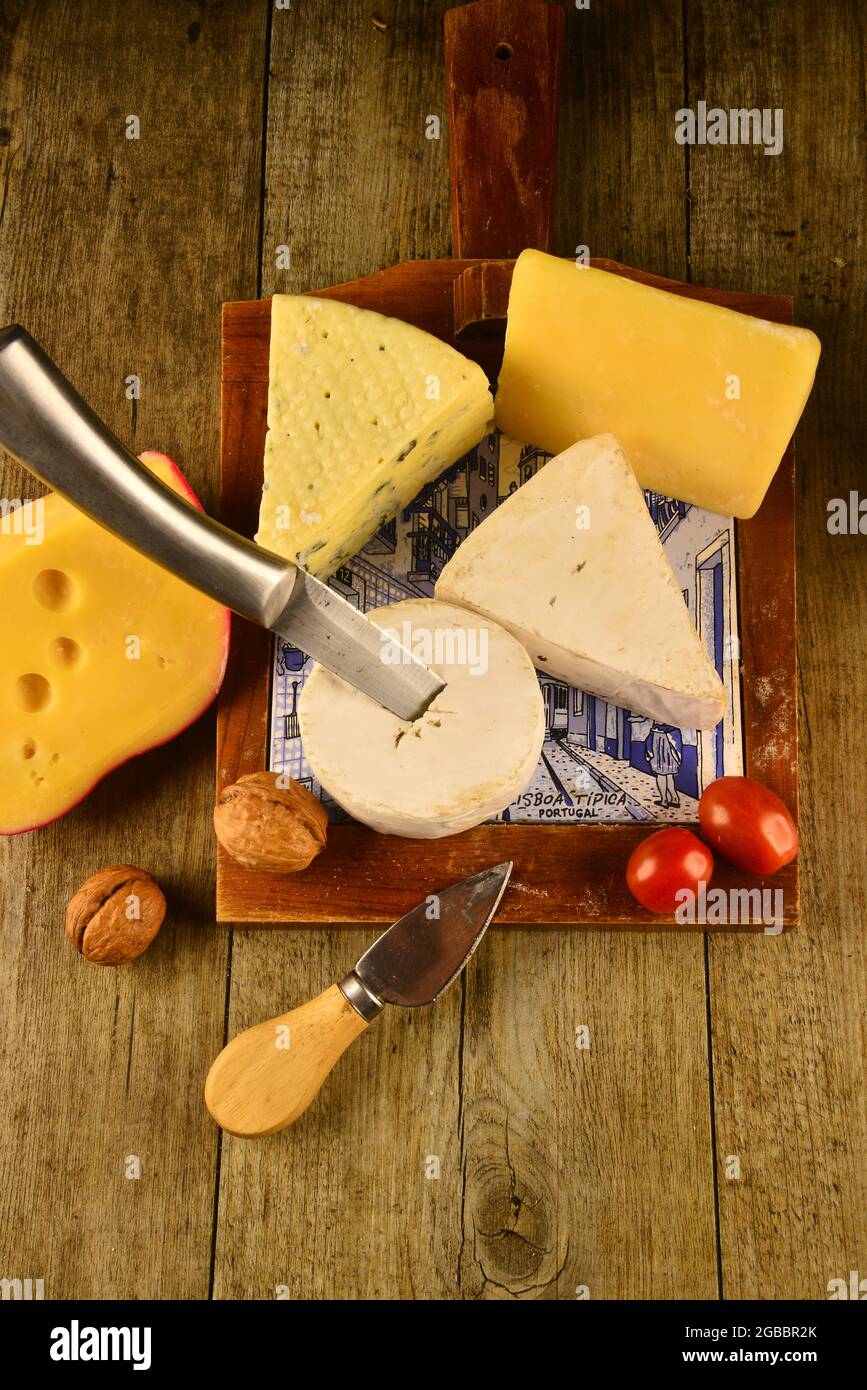 Table of mixed cheese on studio shot Stock Photo - Alamy