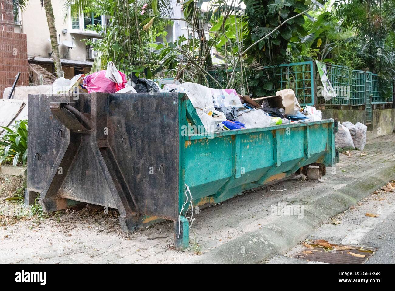 Rubbish dumspter or roro bin with load of waste from construction ...
