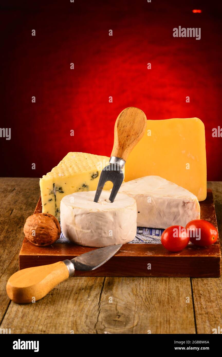 Table of mixed cheese on studio shot Stock Photo - Alamy