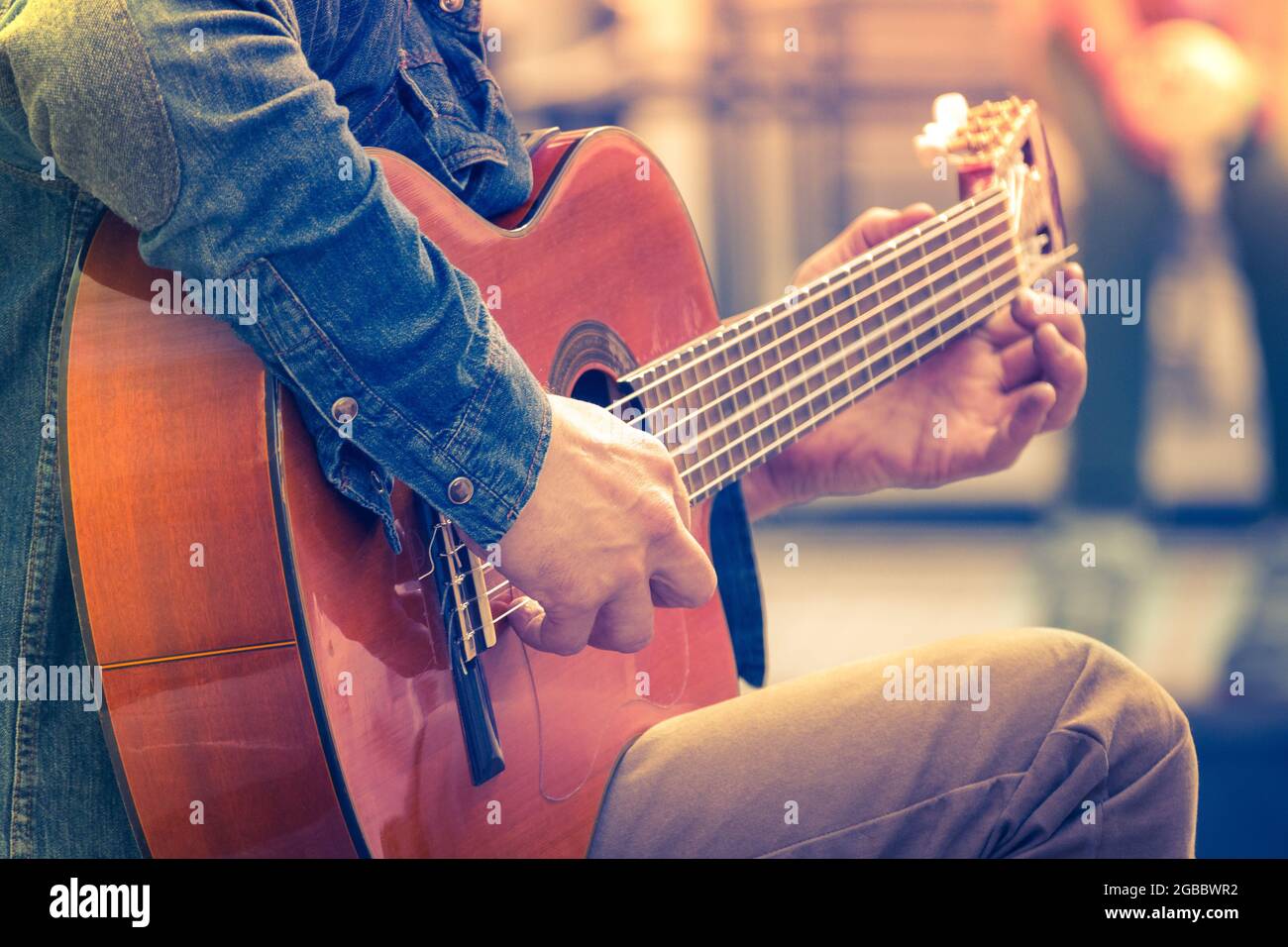A Street Musician Performs a Solo on an Acoustic Guitar Stock Photo - Alamy