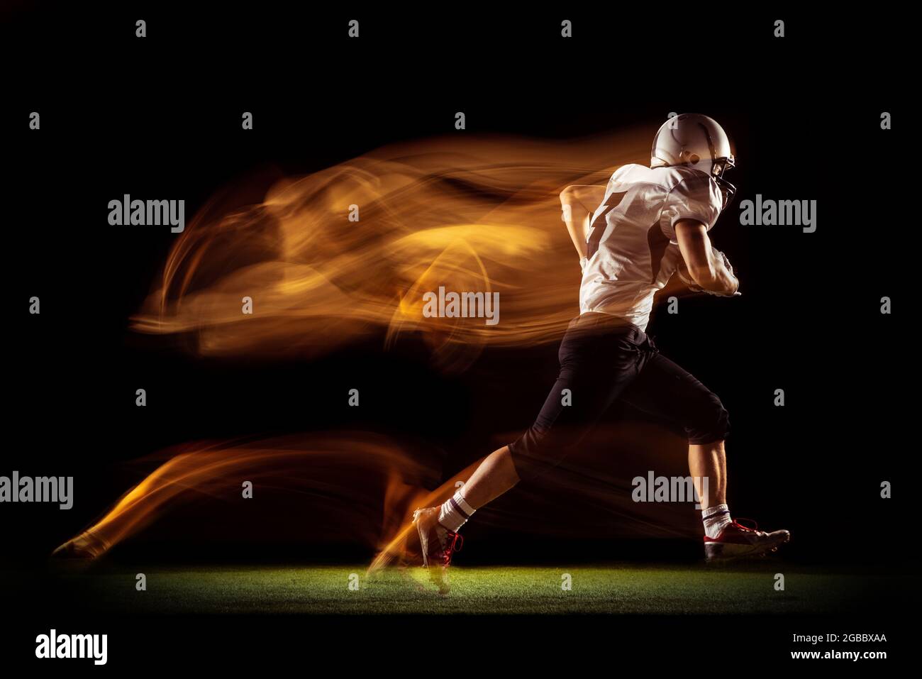 Portrait of young man, American football player training isolated on ...