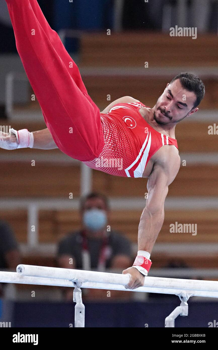Ferhat Arican, of Turkey, performs on the parallel bars during the men ...