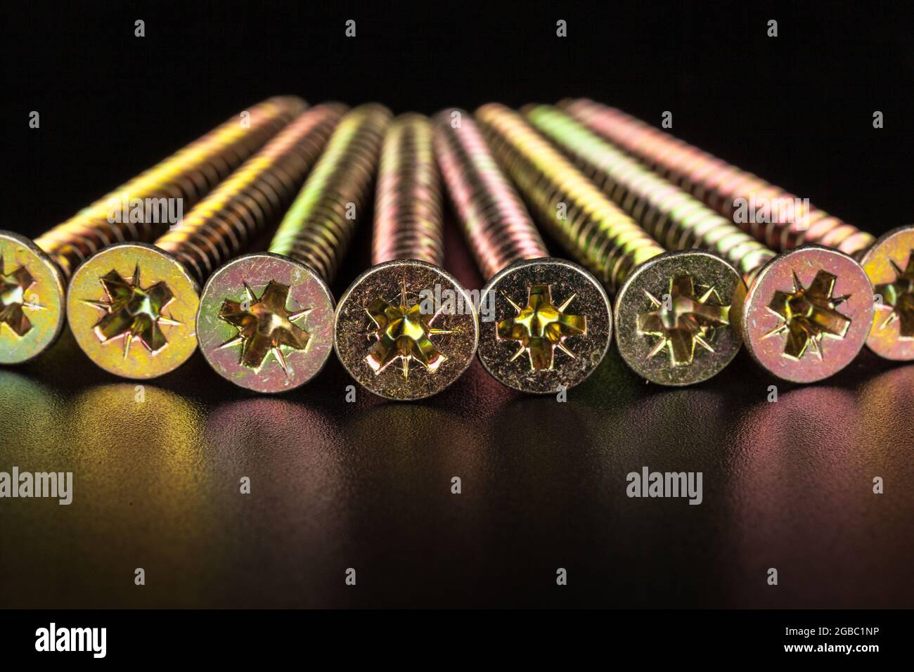 screws on black background Stock Photo - Alamy