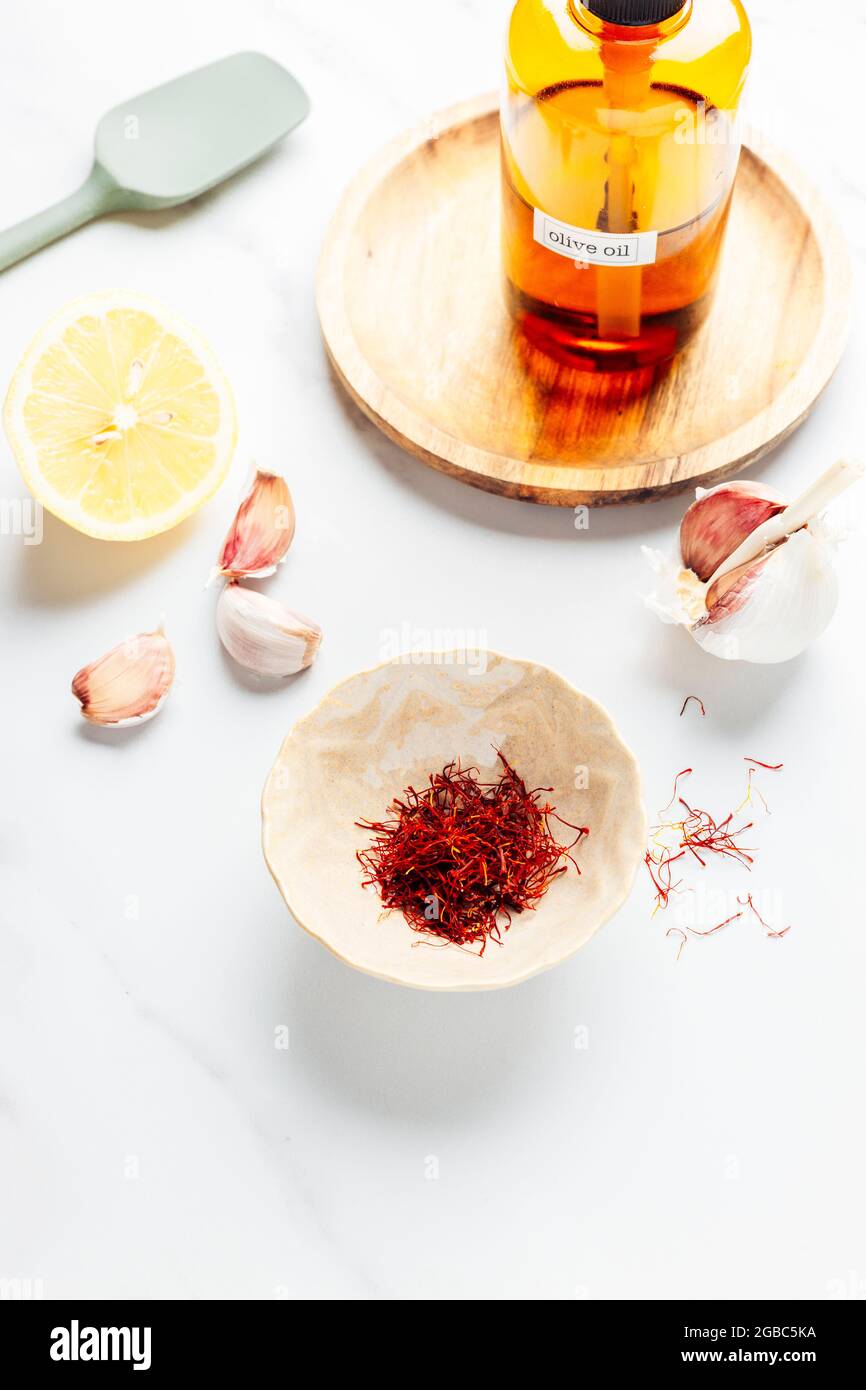 Saffron Spice with Olive Oil and Garlic - FOODPIX WHITE Stock Photo - Alamy