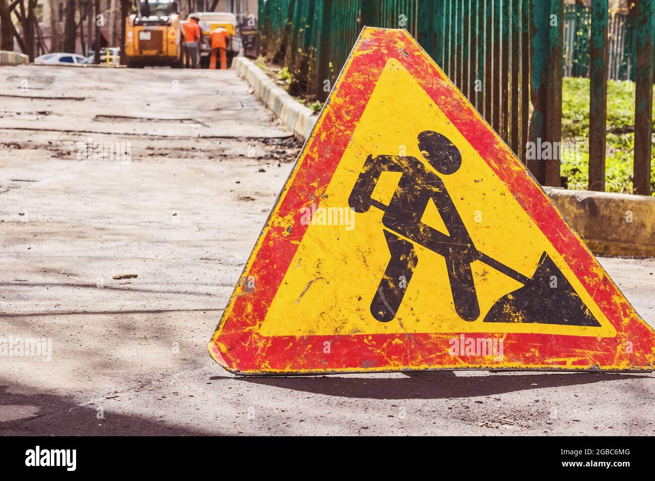A sign of a man with a shovel. Caution, road works are under way ...