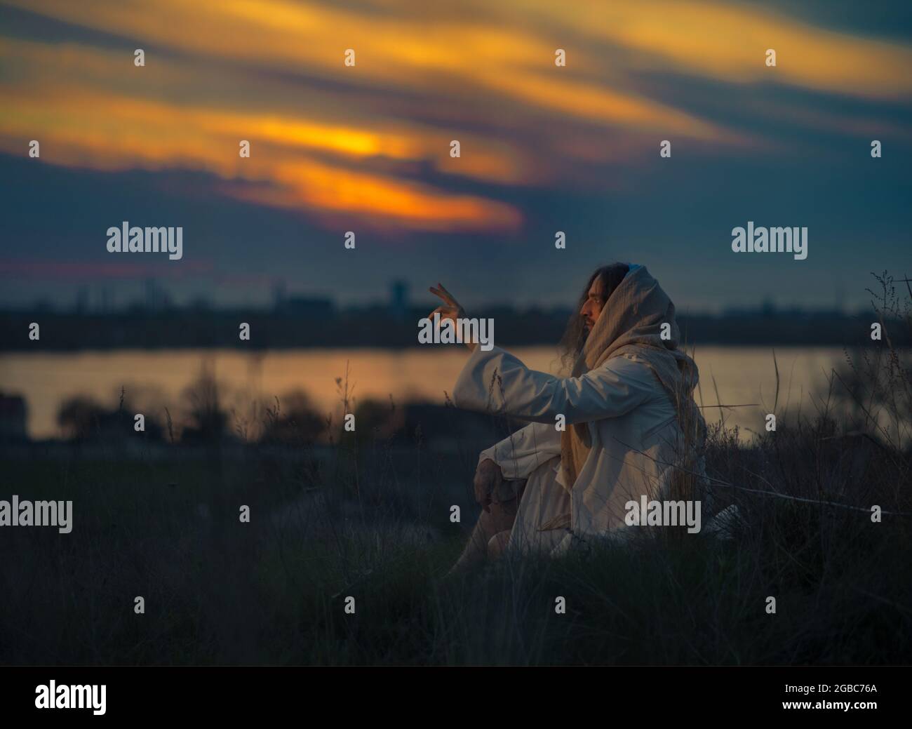 Jesus Christ sitting in meadow and preaching Christian faith conversion ...