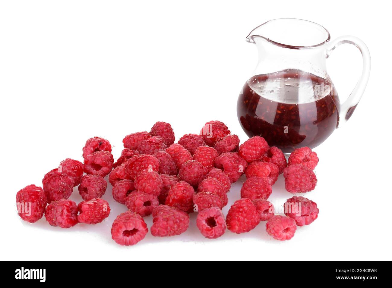Raspberries and jug with jam isolated on white Stock Photo - Alamy