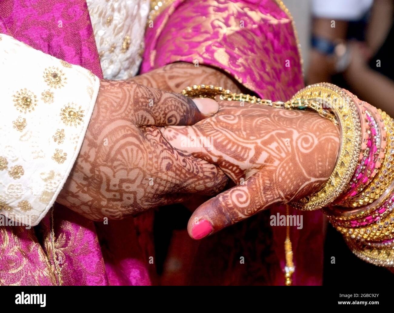 Young adult male groom and female bride holding hands in india Stock ...