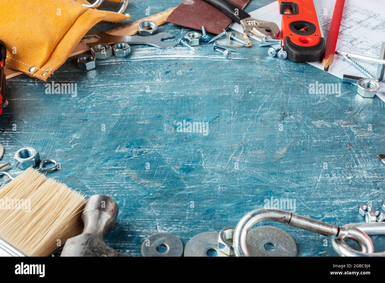 different construction tools on blue background Stock Photo - Alamy