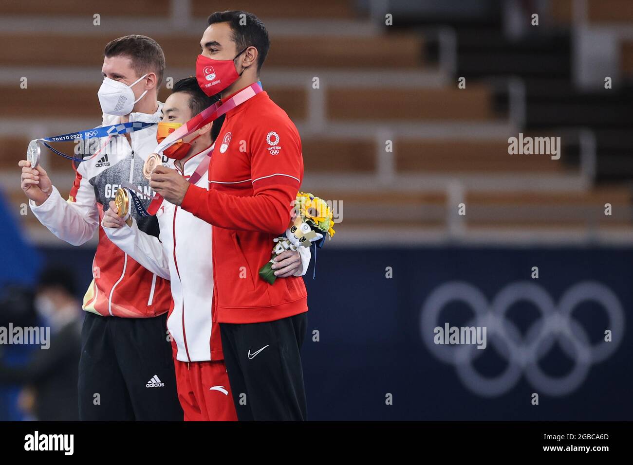 Tokyo, Japan. 3rd Aug, 2021. Zou Jingyuan (C) of China, Lukas Dauser (L ...