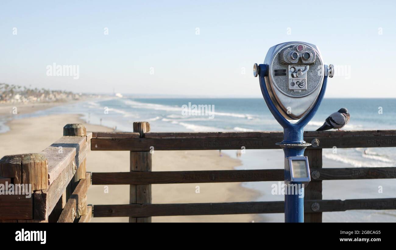 Metallic stationary observation tower viewer, waterfront old binoculars ...