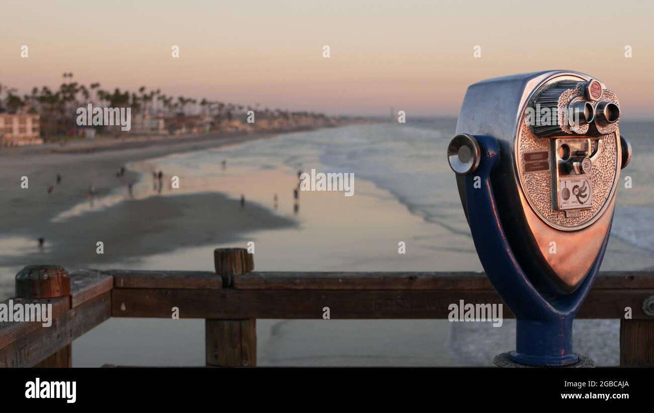 Metallic stationary observation tower viewer, waterfront old binoculars ...