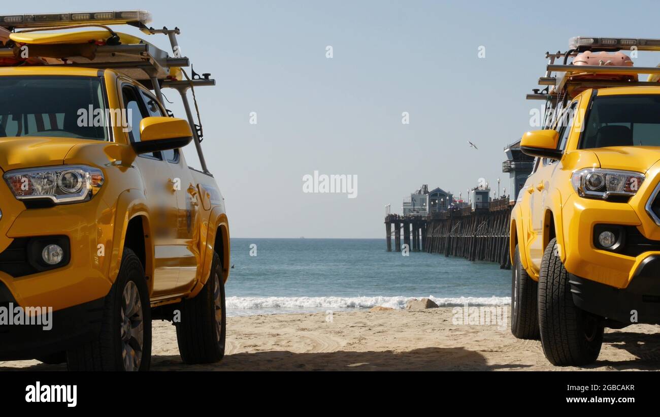 Yellow lifeguard car, Oceanside beach, California USA. Coastline rescue ...