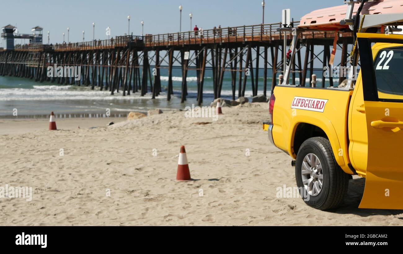 Yellow lifeguard car, Oceanside beach, California USA. Coastline rescue ...