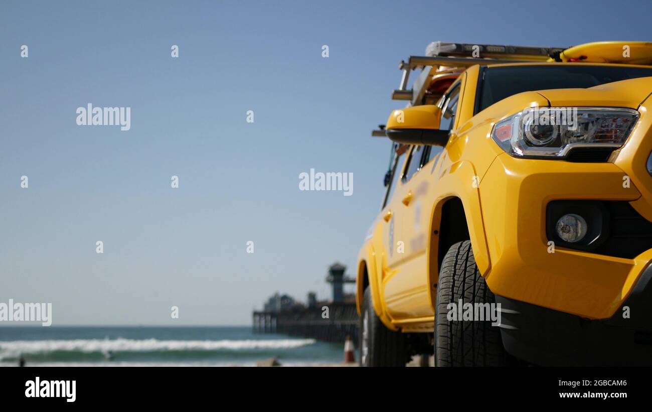 Yellow lifeguard car, Oceanside beach, California USA. Coastline rescue ...