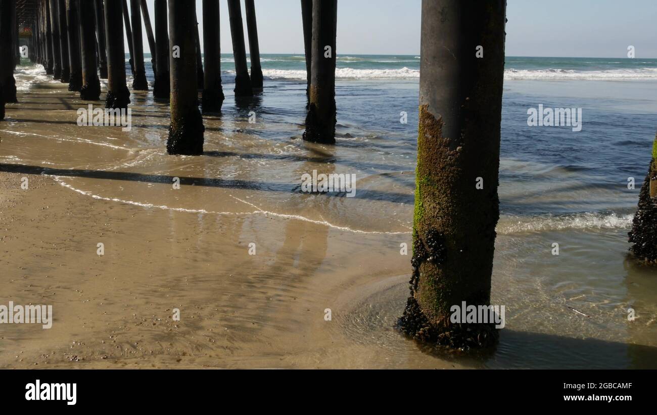 Wooden piles under boardwalk, old pier in Oceanside, California coast ...