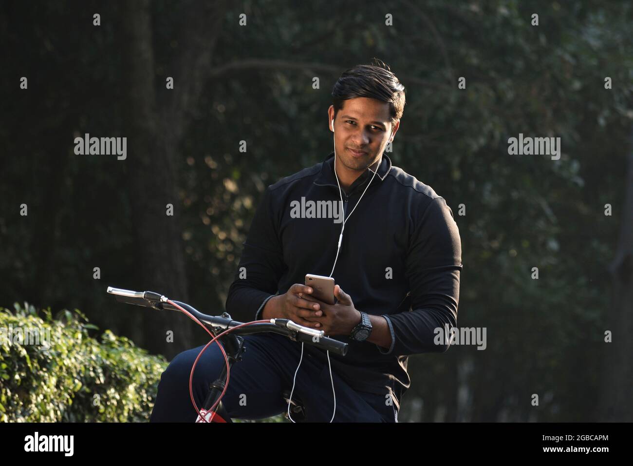 Indian man with cycle hi-res stock photography and images - Alamy