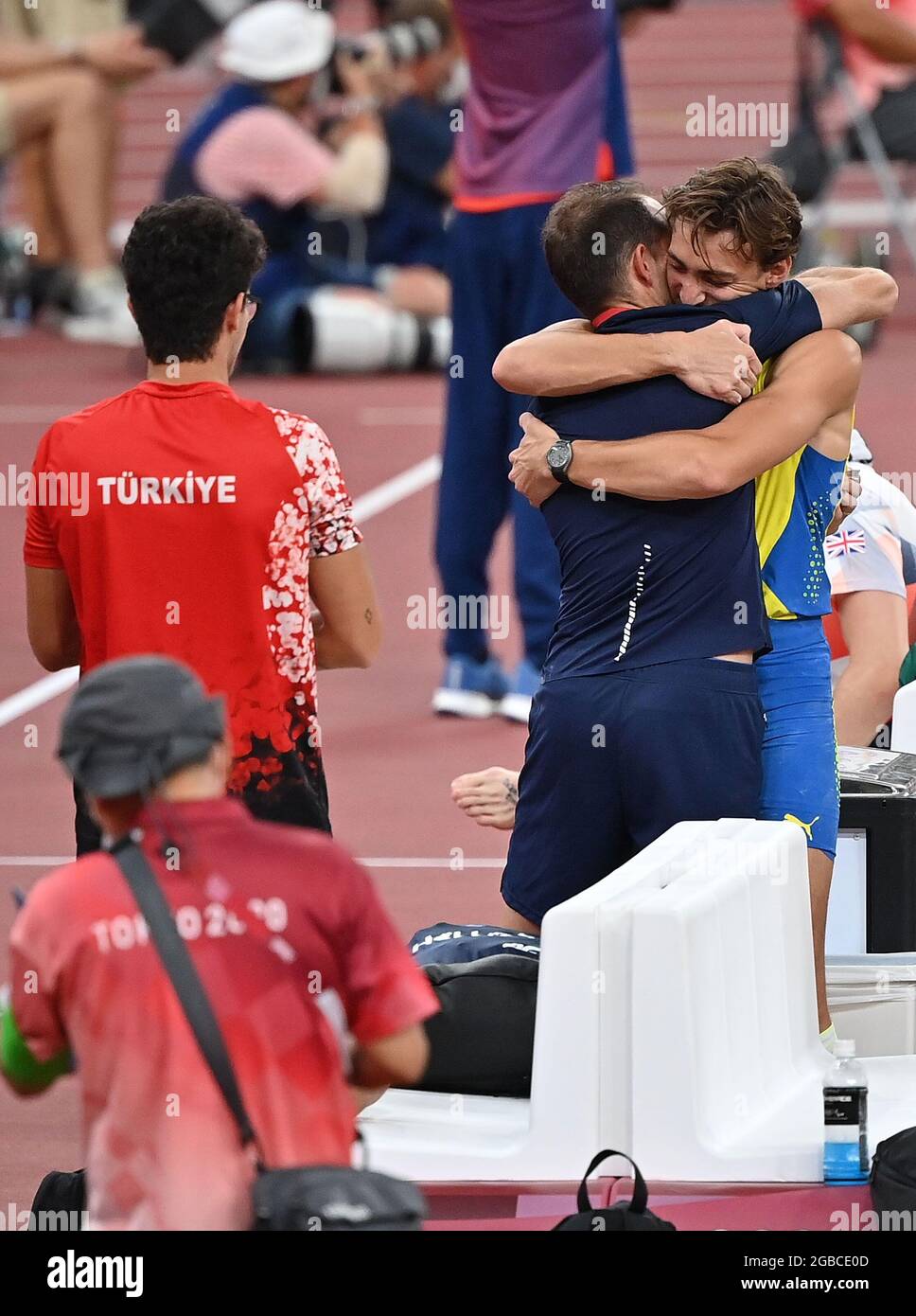 Tokyo, Japan. 3rd Aug, 2021. Armand Duplantis (1st R) of Sweden hugs ...