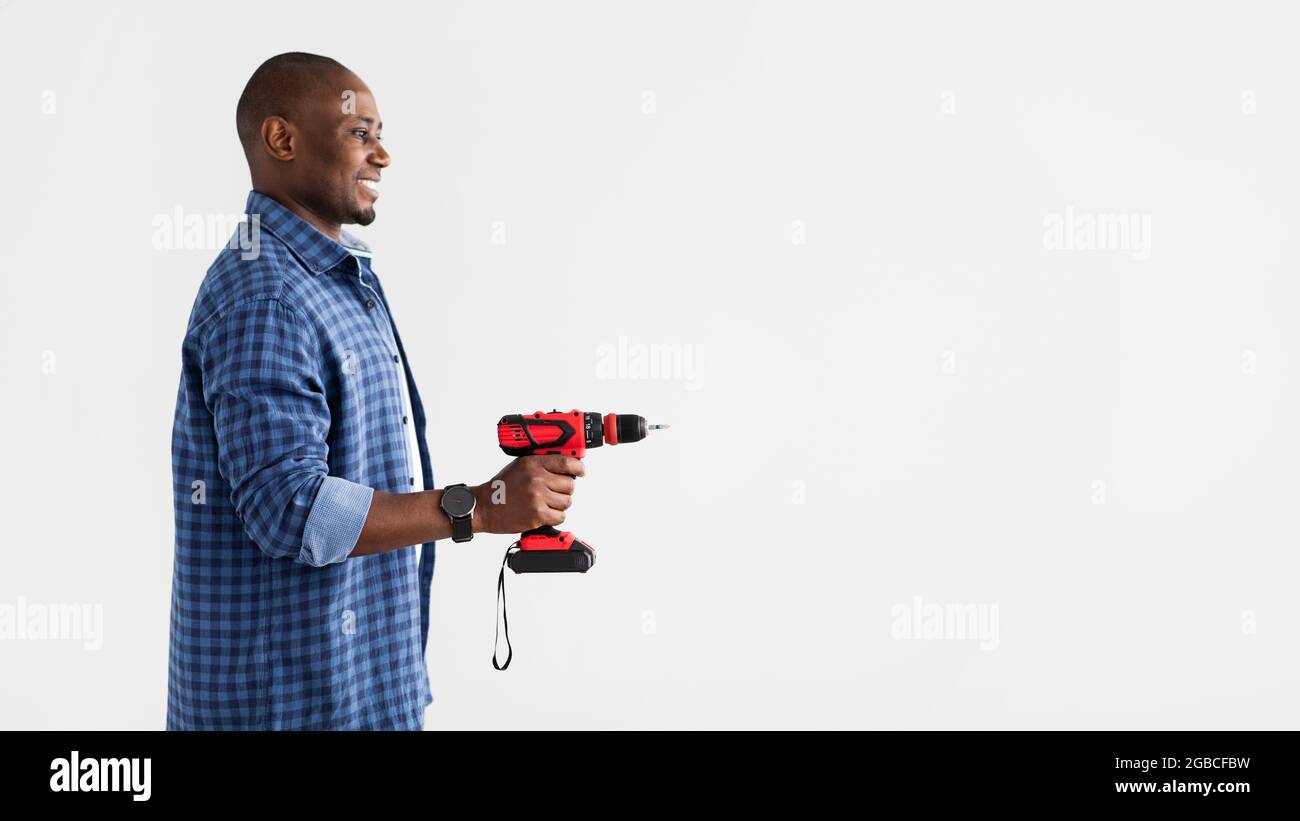 Tool for drilling, fixing and professional builder. African american ...