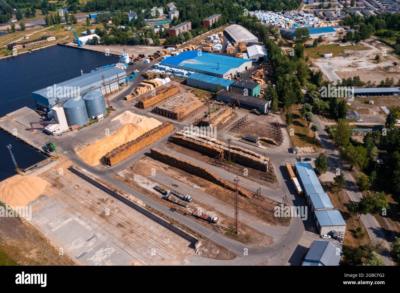 Wood pile wall outside factory with at a industrial patio Stock Photo ...