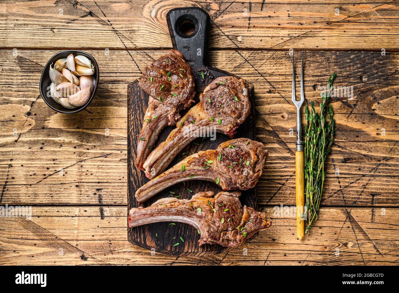 Grilled lamb mutton meat chops steaks on a cutting board. wooden ...