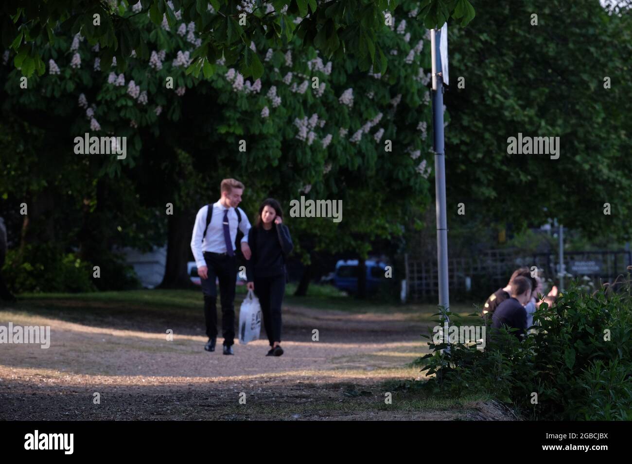 couple walking along tow path Stock Photo - Alamy