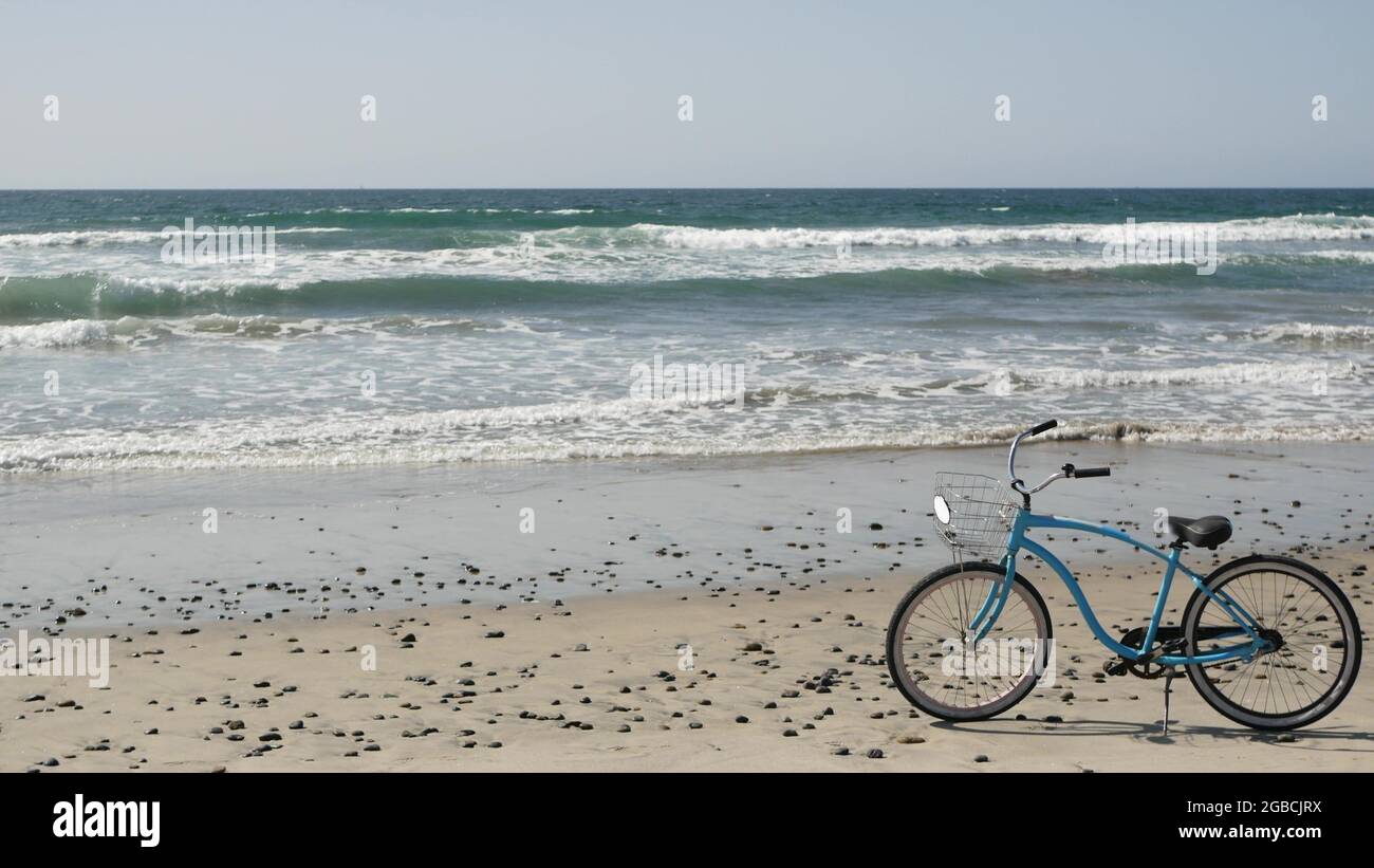 Blue bicycle, cruiser bike by ocean beach pacific coast, Oceanside ...