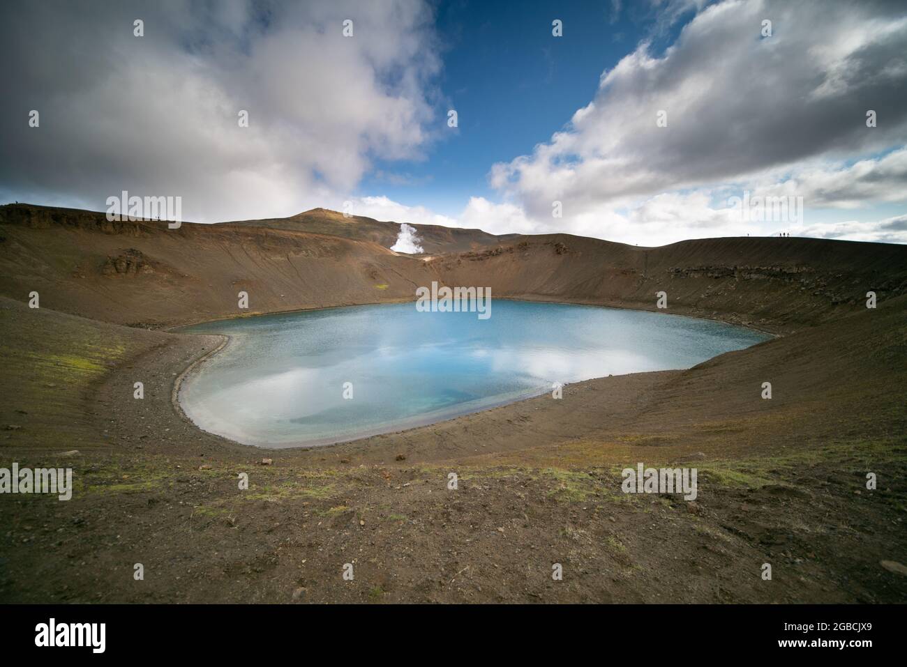 The mouth of a volcano crater filled with water in Iceland. Water Lake ...