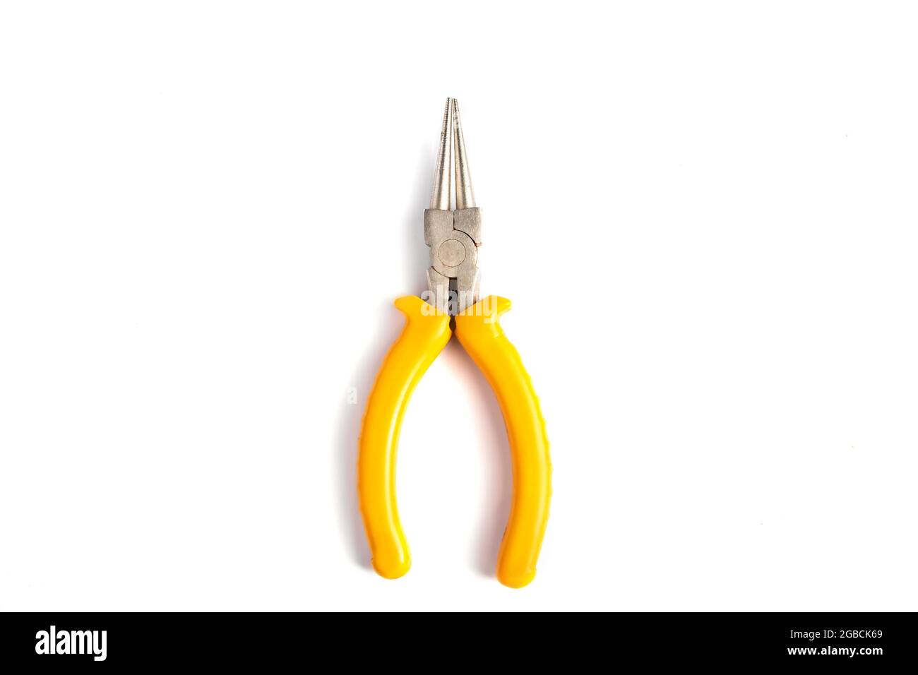 Pliers with yellow insulating handles on a white background. Working ...