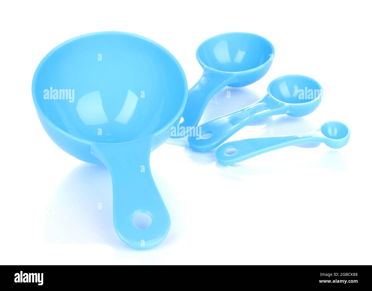 Blue measuring spoons isolated on white Stock Photo - Alamy