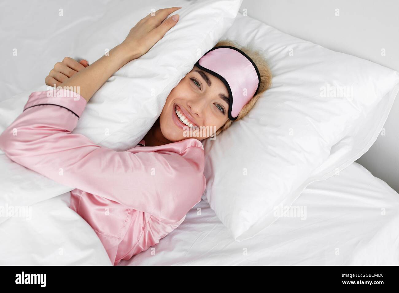 Pretty blonde woman sleeping in bed hi-res stock photography and images ...