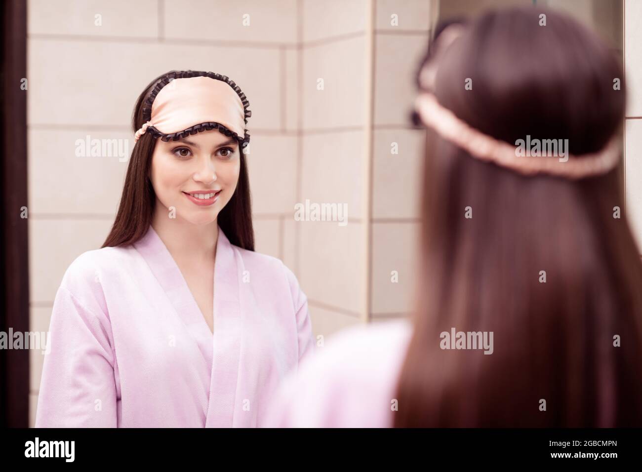 Photo of charming sweet young woman nightwear pink bathrobe looking ...