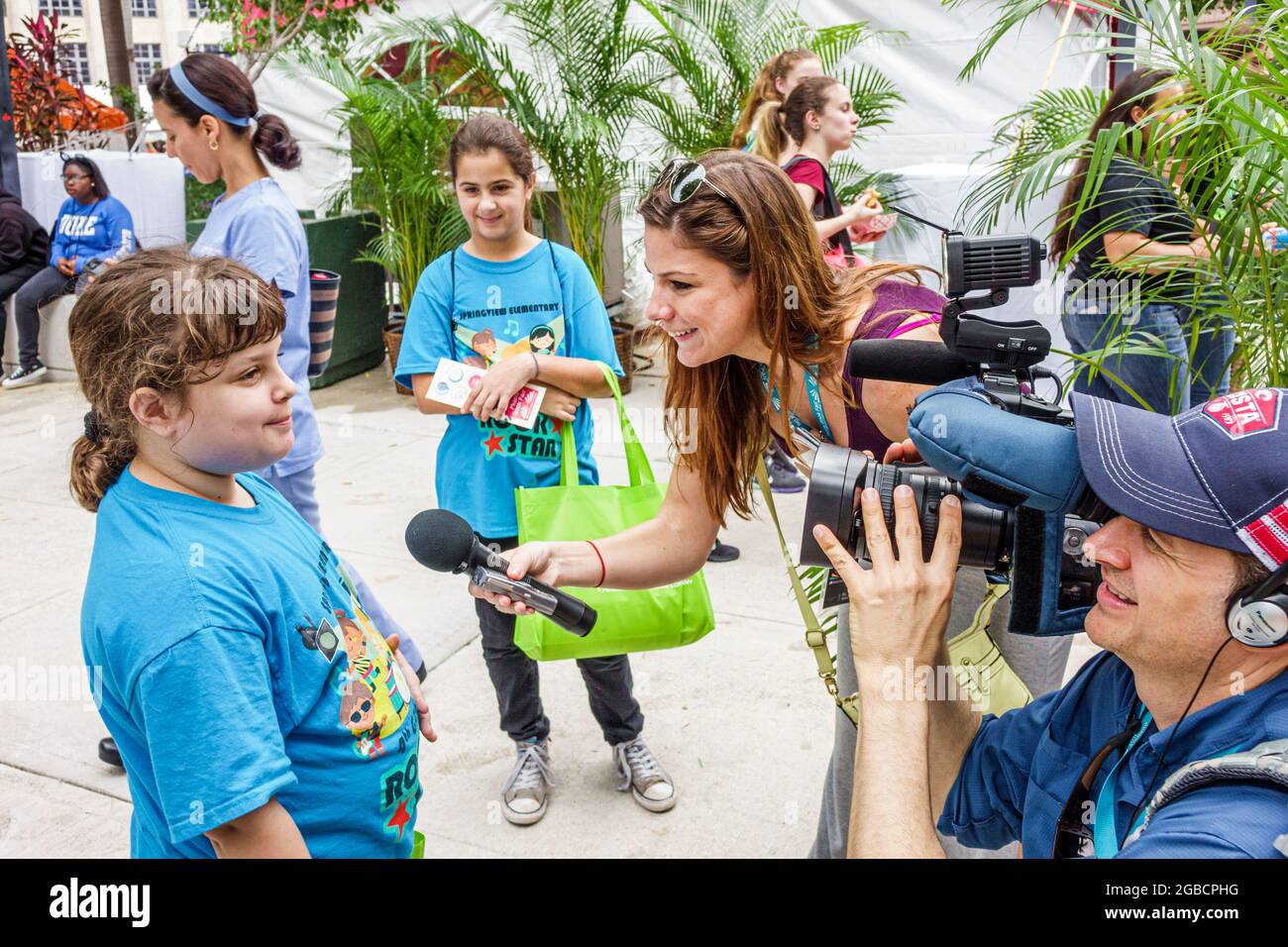Interviewing interviews interview student girl cameraman microphone hi ...