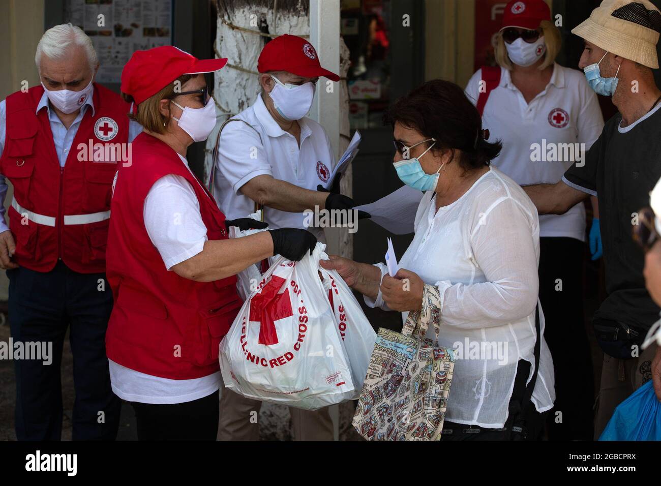 ATHENS, Aug. 3, 2021: A volunteer from the Hellenic Red Cross ...
