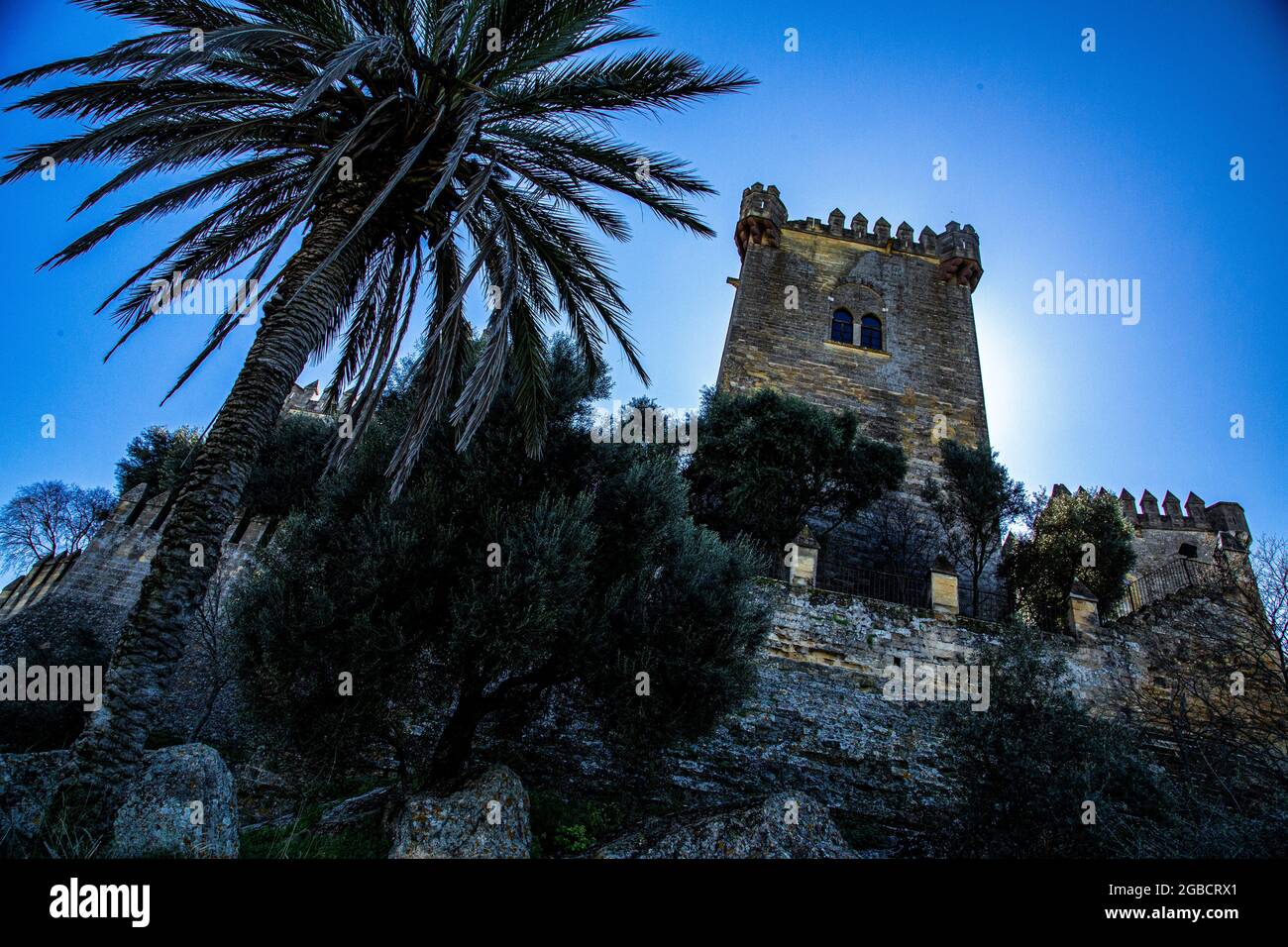 Fortified castle with large walls and robust square towers, restored ...