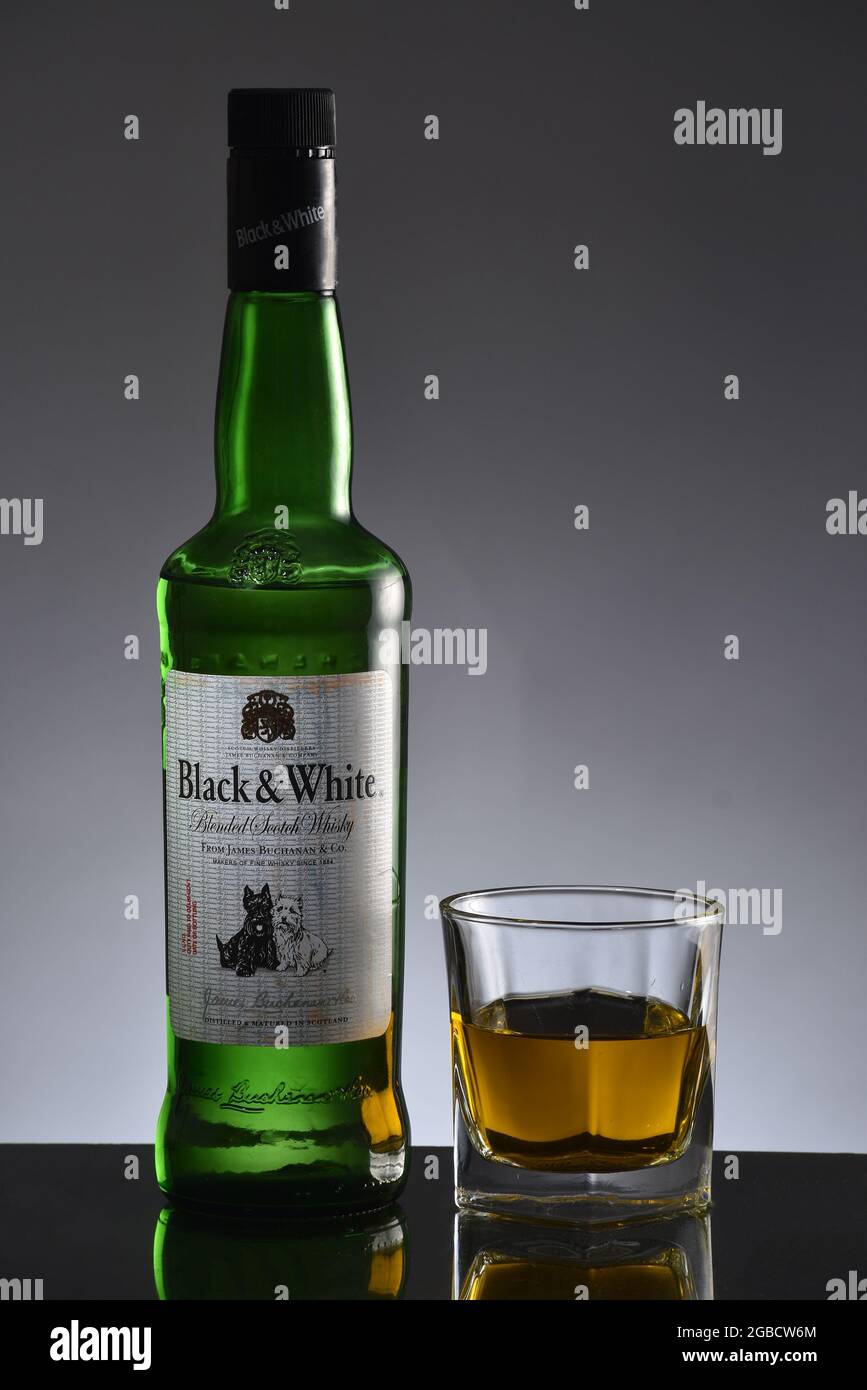 New Delhi, India. 22 April 2016: Whisky Bottle With Glass against Grey ...