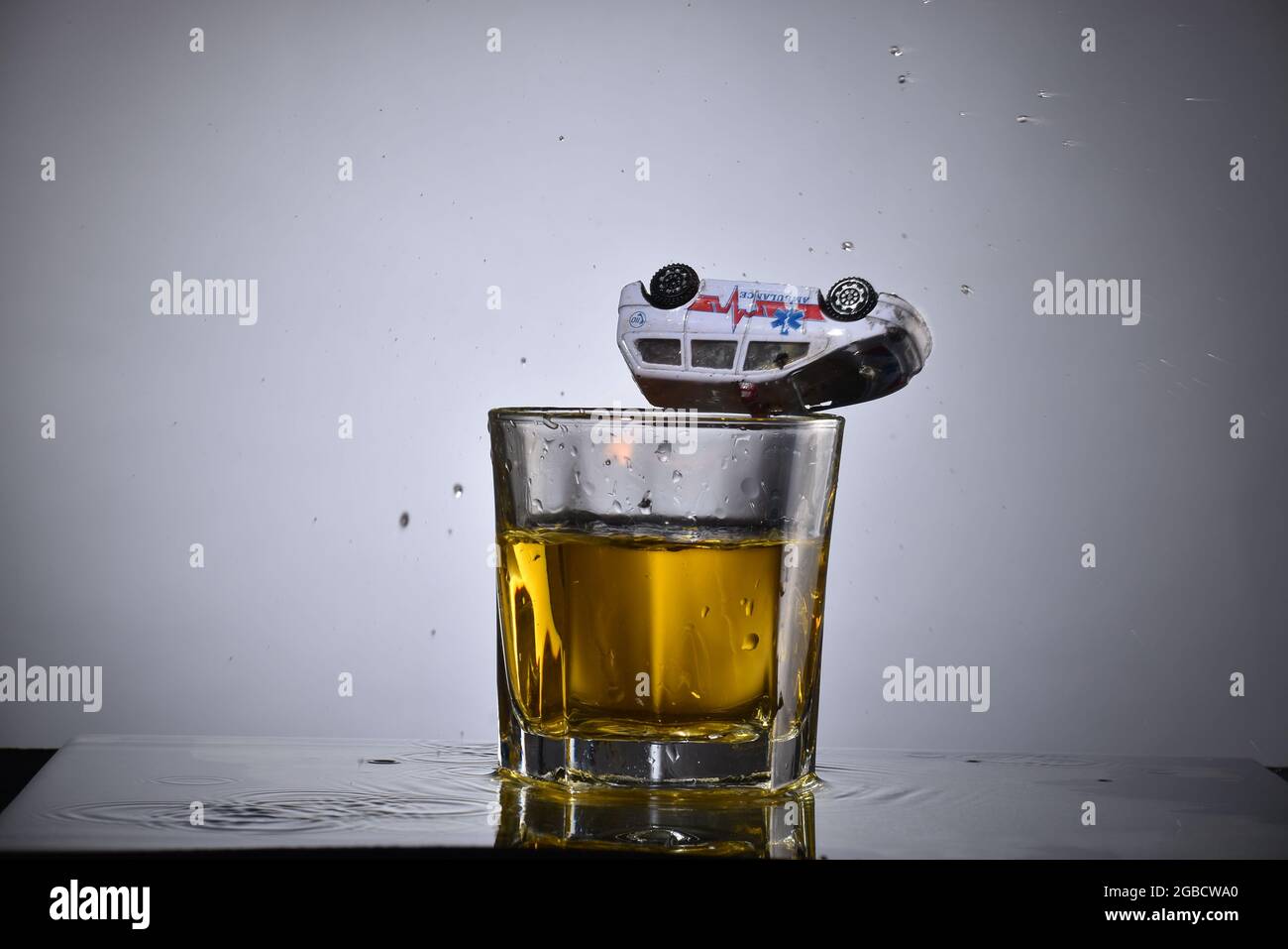 Car Drown in Alcohol Glass, Drink and Drive Concept Stock Photo - Alamy