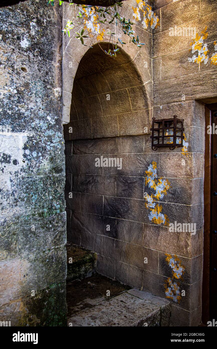 Passageway between castle walls and towers, with arch and doors ...