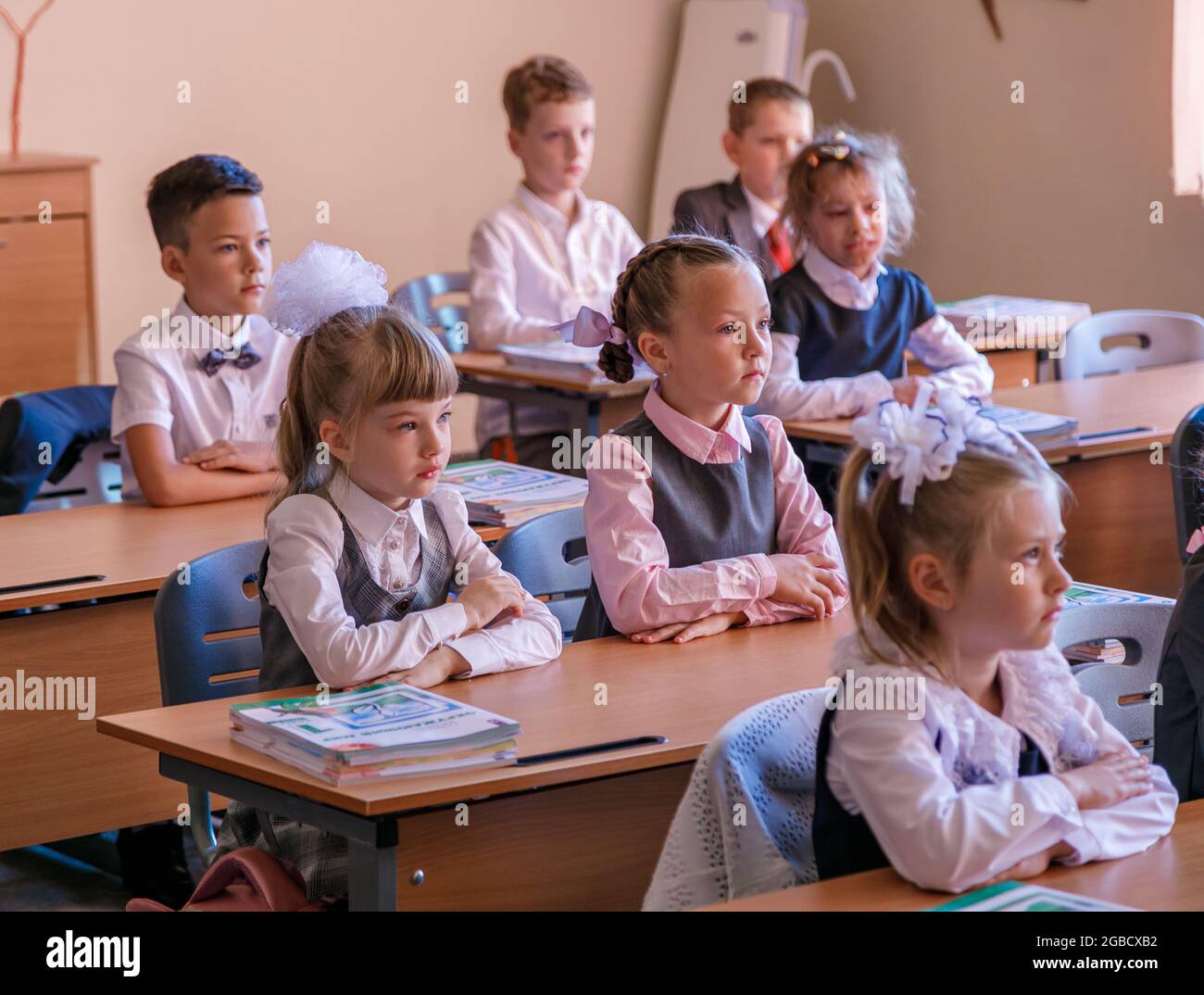 Children sit at their desks in class on September 1. First graders ...