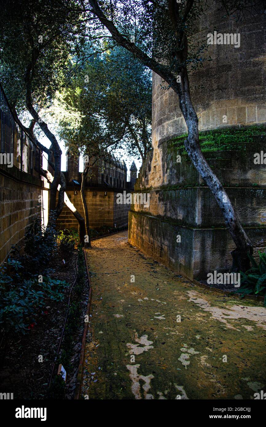 Passageway between castle walls and towers, with arch and doors ...