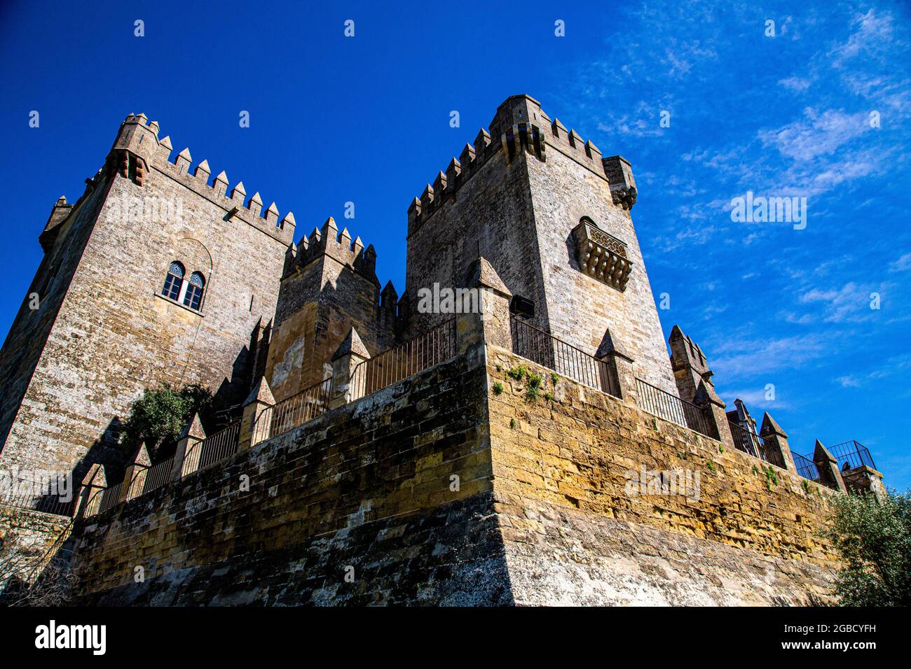 Fortified castle with large walls and robust square towers, restored ...