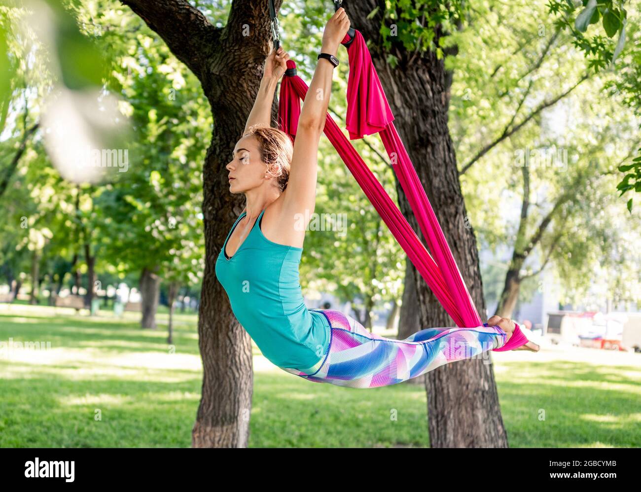 Girl doing fly yoga Stock Photo - Alamy