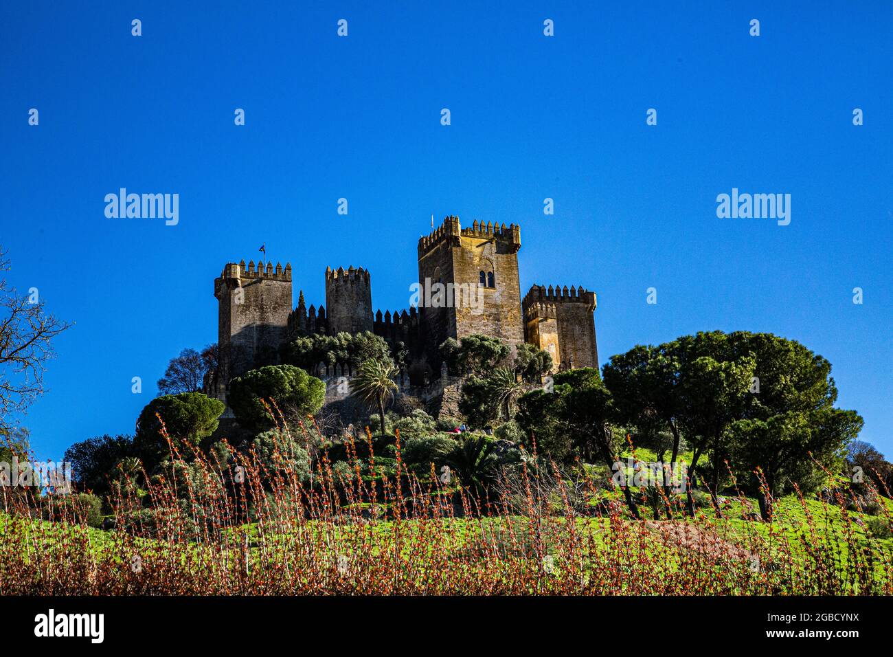Fortified castle with large walls and robust square towers, restored ...