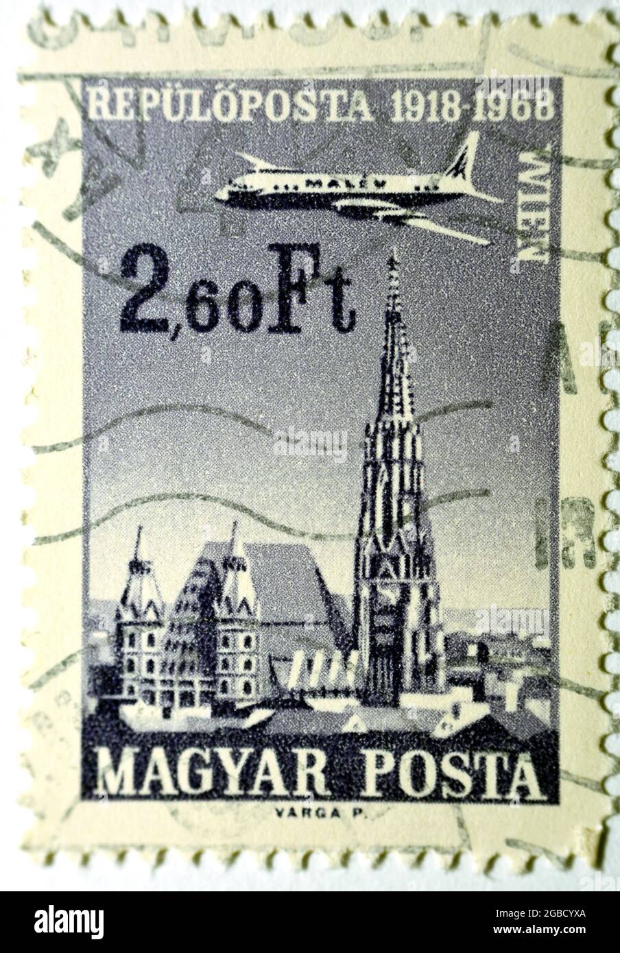 A postage stamp printed in Hungary shows plane over Vienna, Austria ...