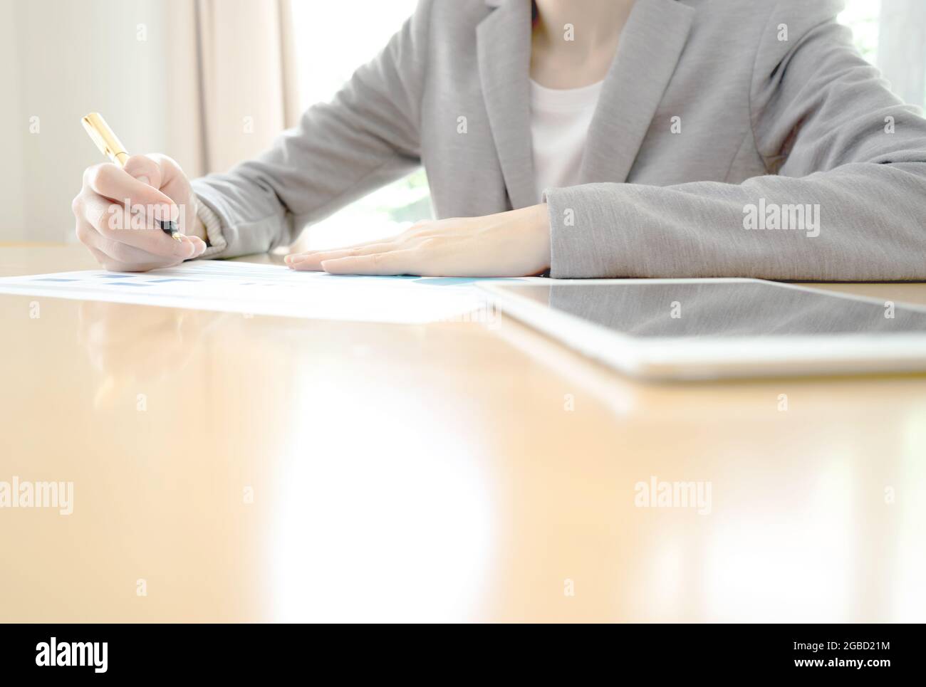 Businesswoman writing something Stock Photo - Alamy